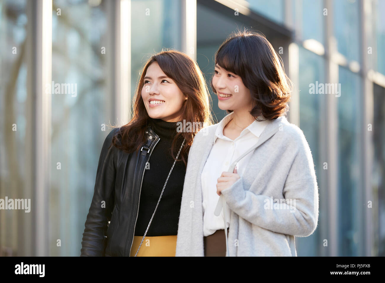 Japanese women window shopping downtown Tokyo Stock Photo - Alamy