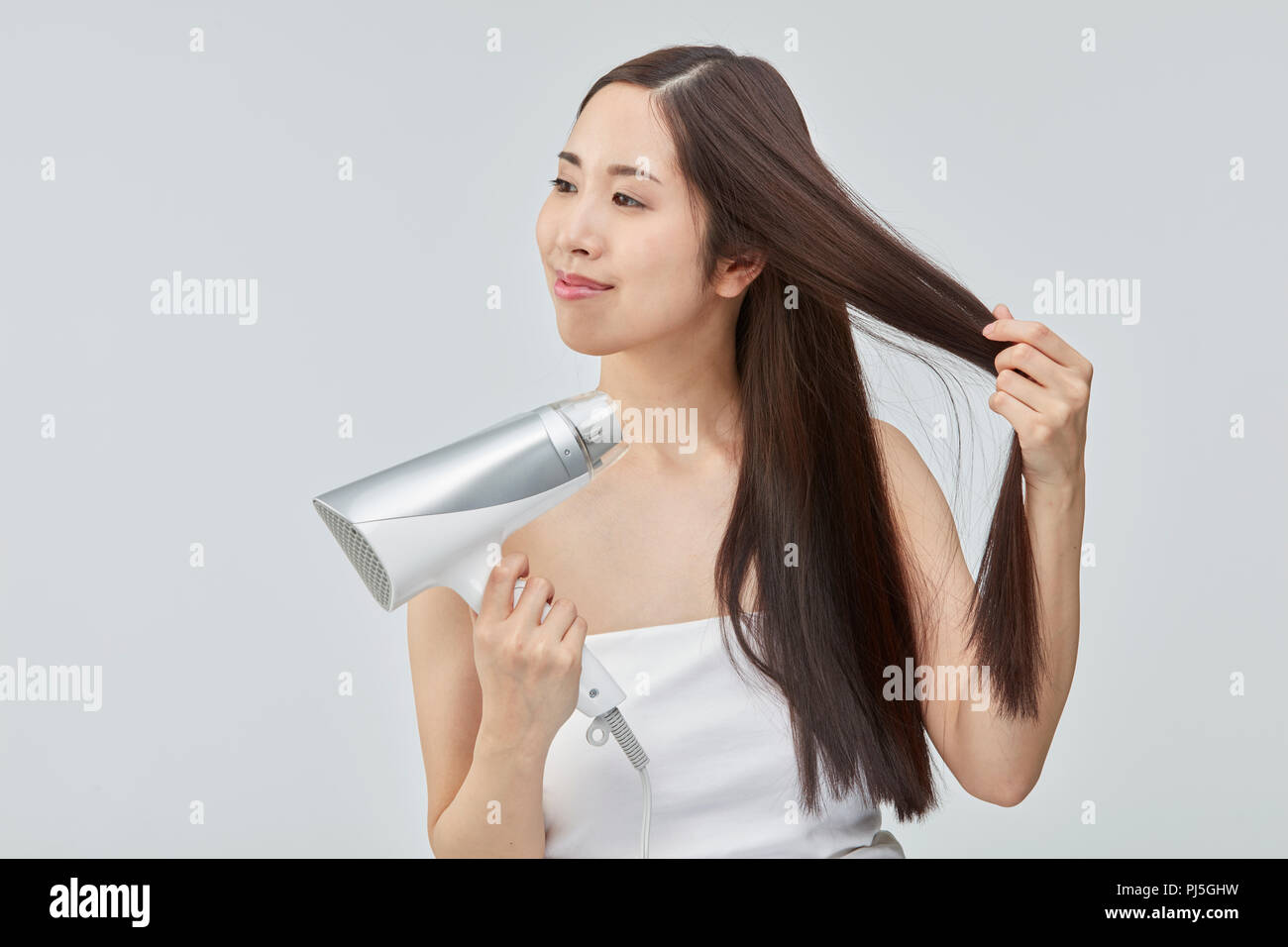 Japanese woman with silky hair Stock Photo - Alamy
