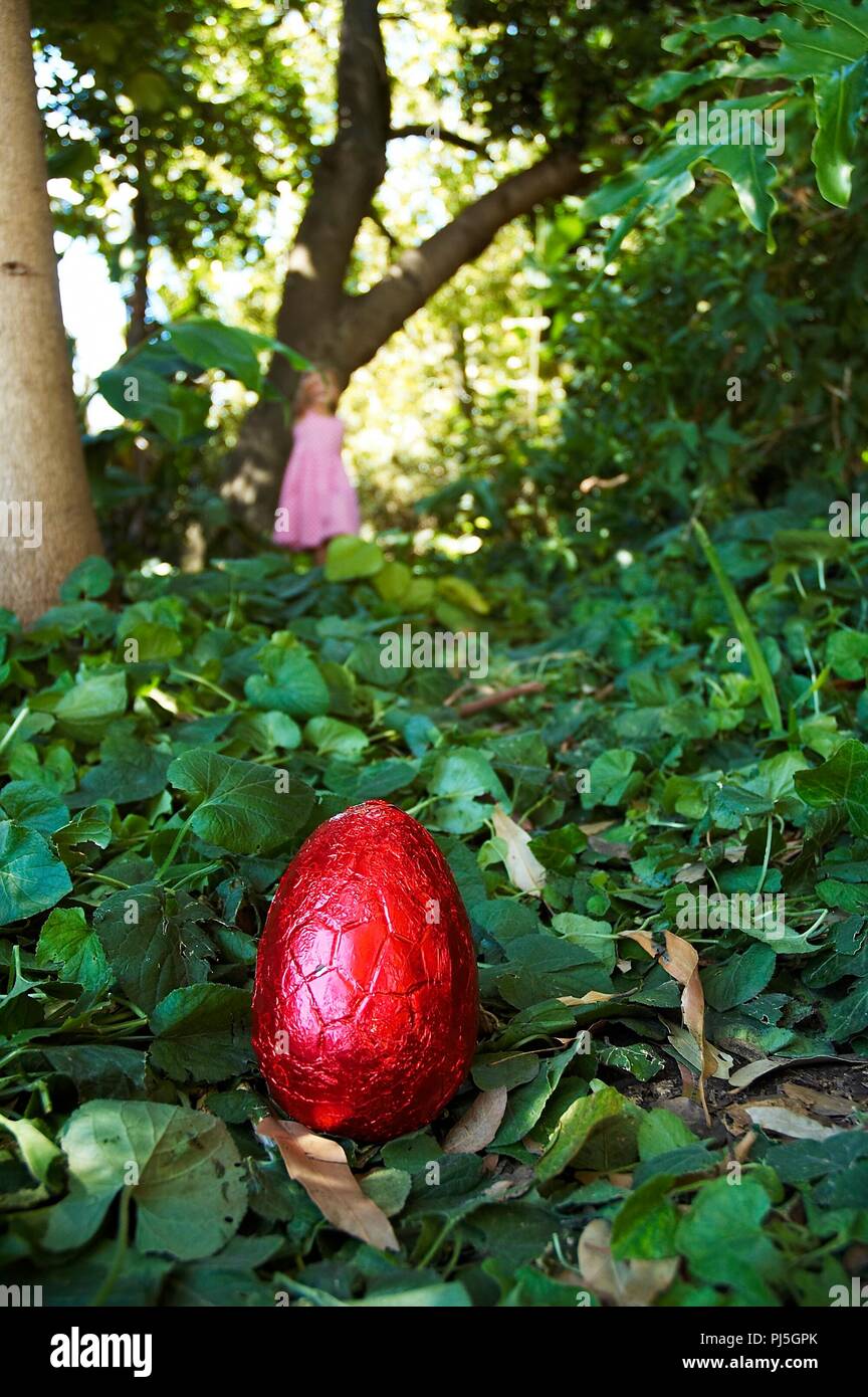 A little girl hunting for chocolate Easter eggs Stock Photo - Alamy