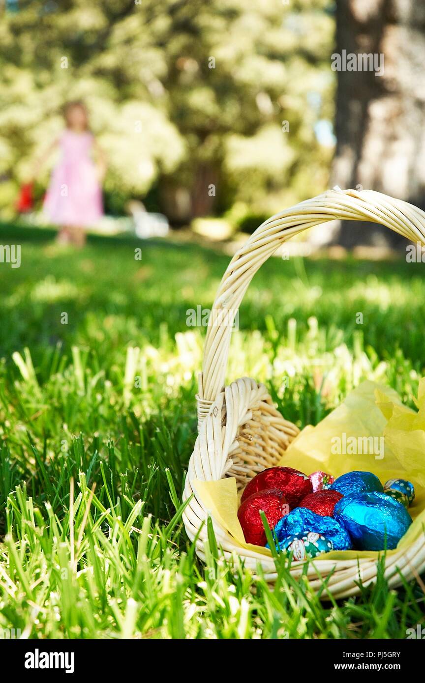 A little girl hunting for chocolate Easter eggs Stock Photo - Alamy