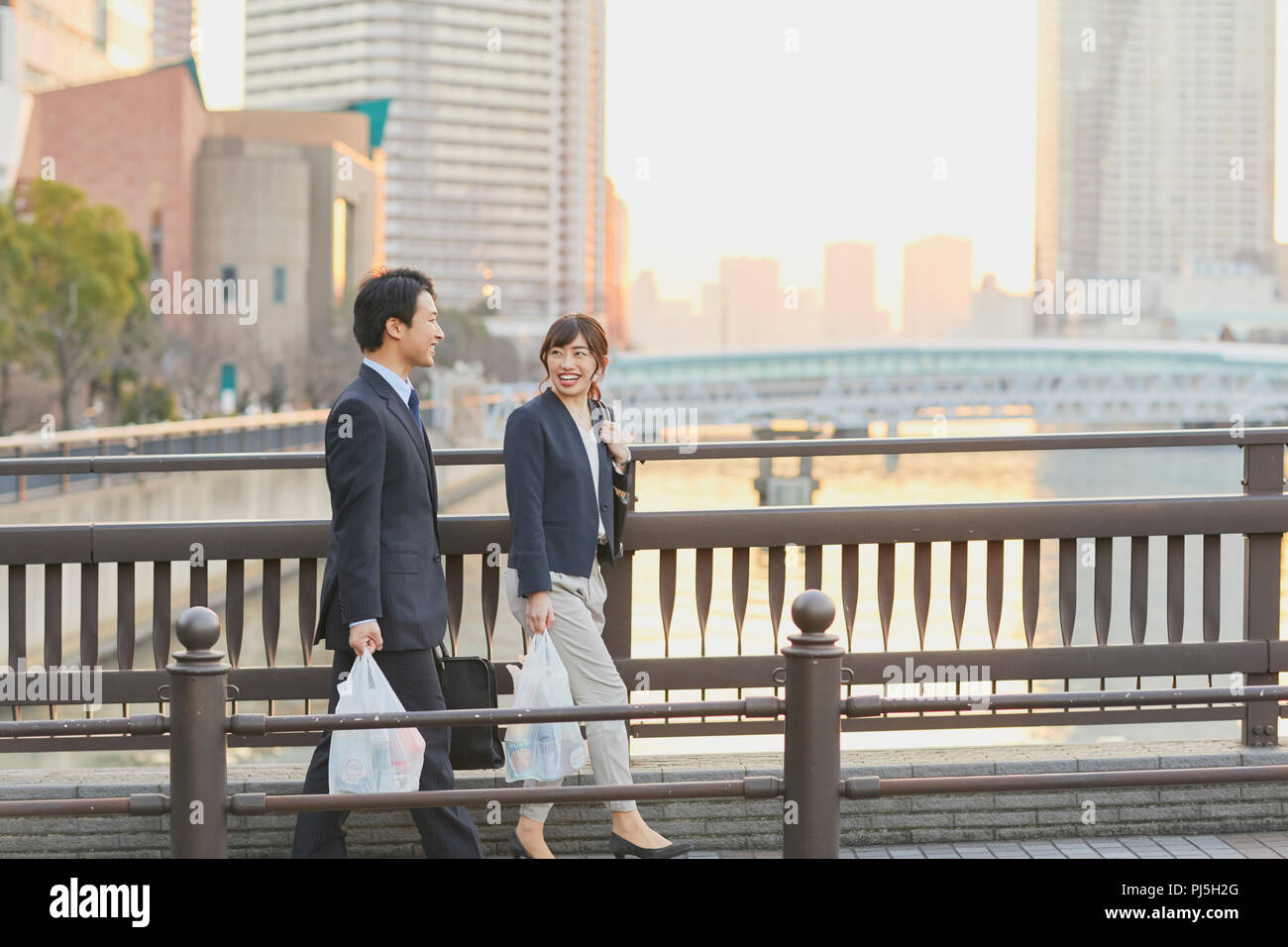 Woman coming home from work hi-res stock photography and images - Alamy