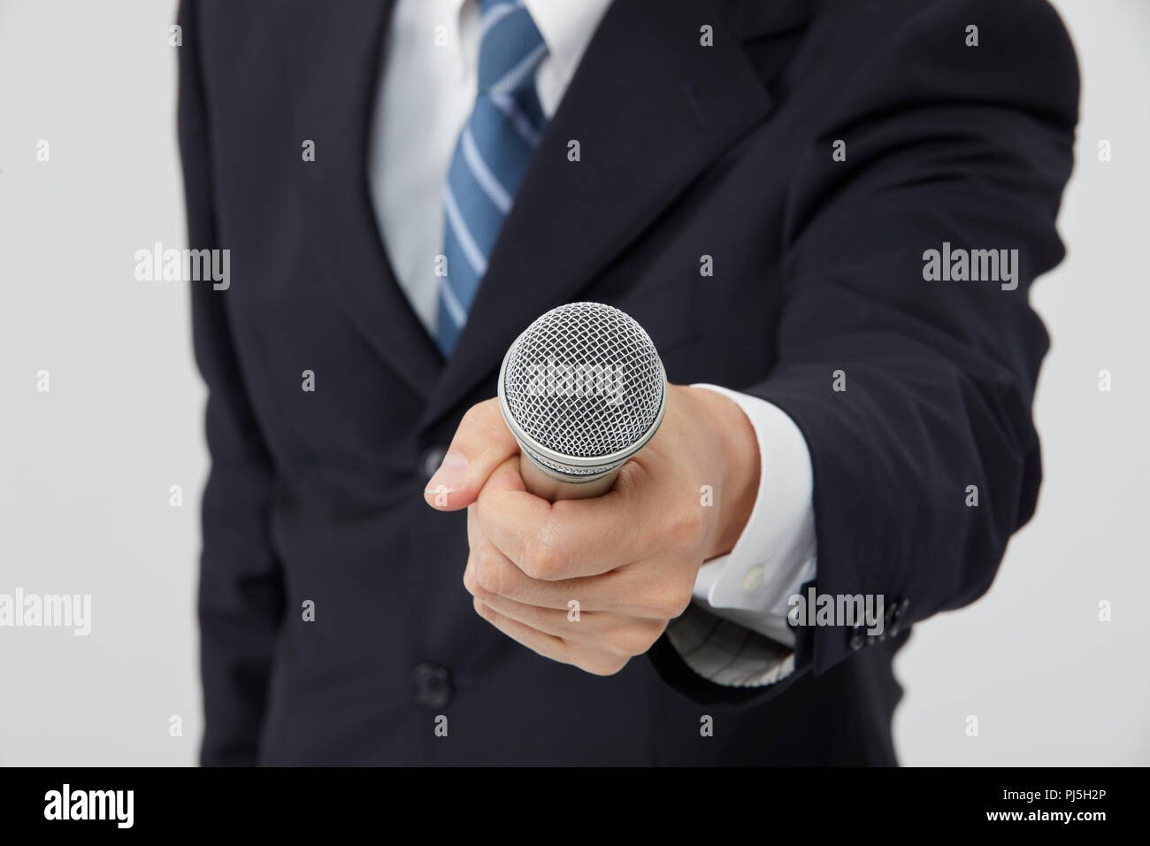 Hand holding microphone Stock Photo - Alamy