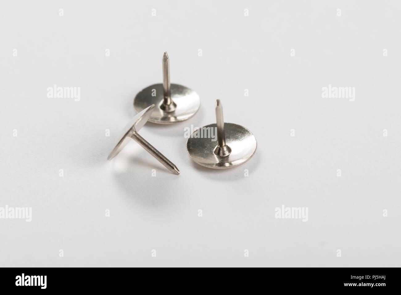 Group Of Metal Thumb Tacks for background Stock Photo - Alamy