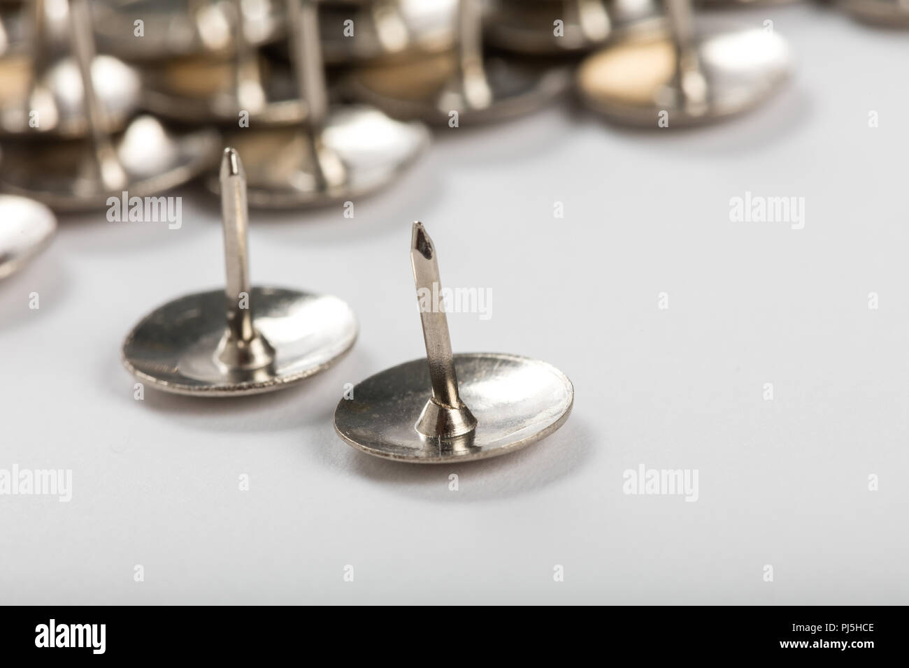 Group Of Metal Thumb Tacks for background Stock Photo - Alamy
