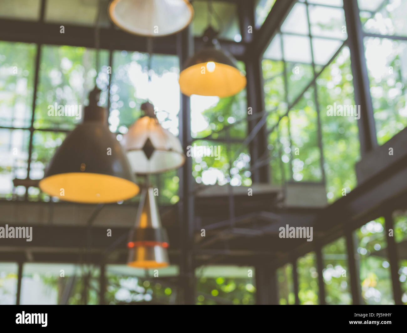 Blurred cafe background. Ceiling lamp in coffee shop blur background ...