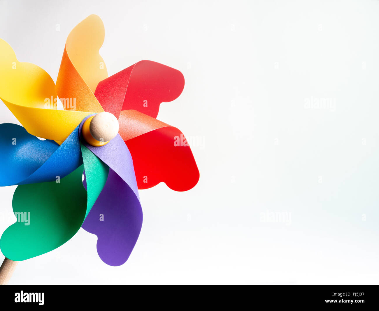 Beautiful colorful pinwheel isolated on white background with copy ...