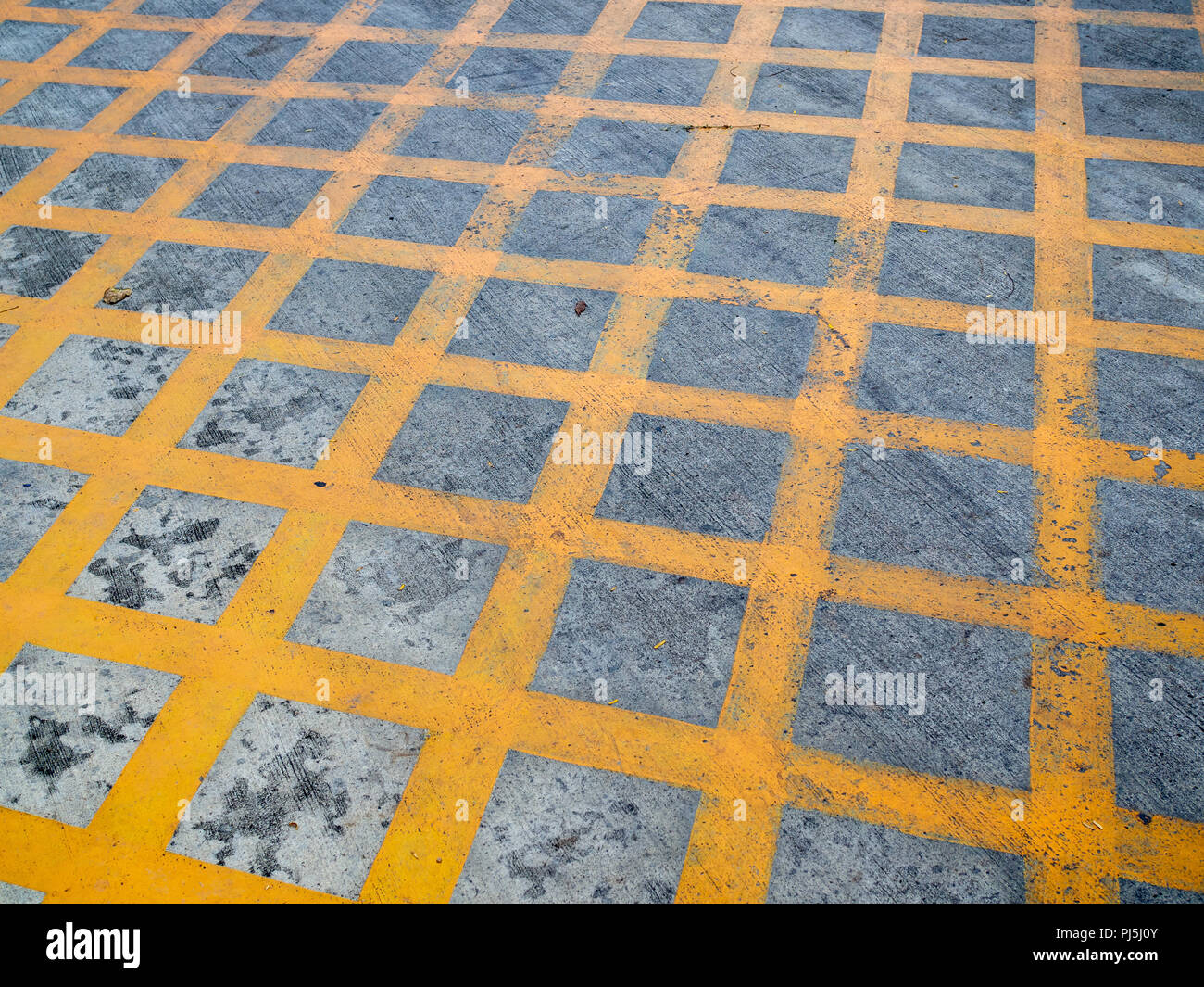 No parking cross yellow line on the ground. Yellow junction box on the ...