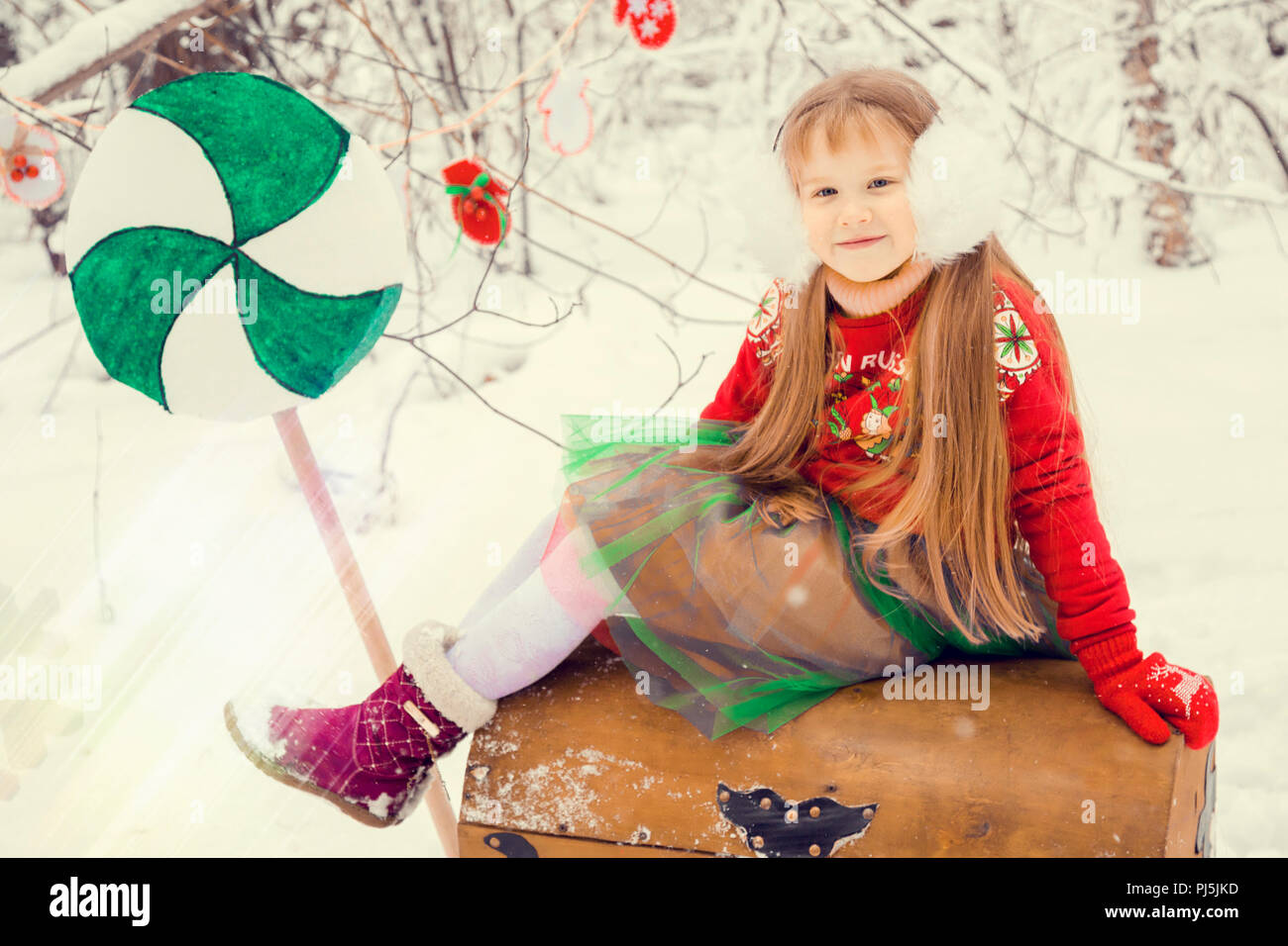 A Little Red Haired Girl With Long Hair In A Lush Skirt And A Green 6136