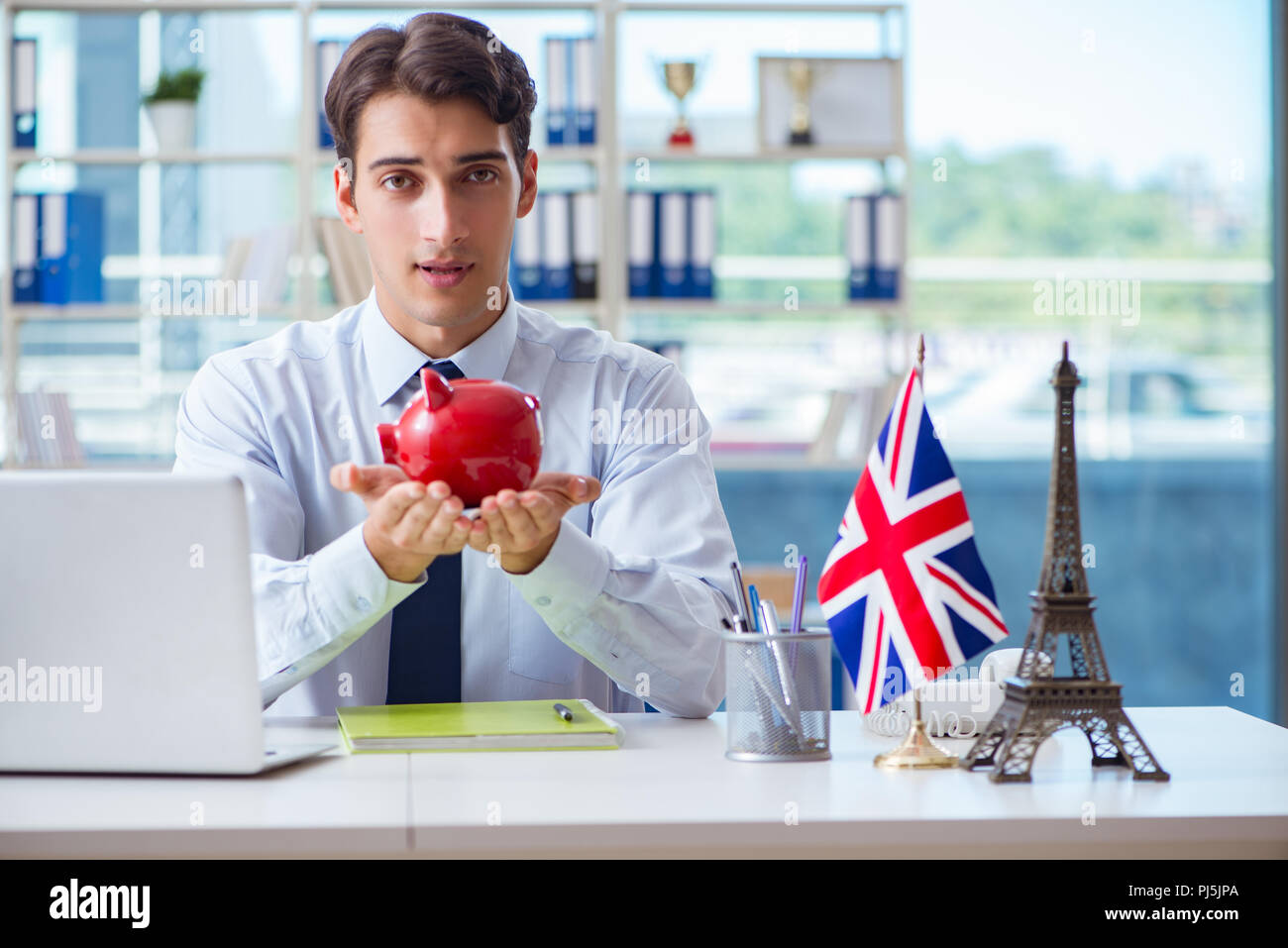 Sales agent working in travel agency Stock Photo - Alamy