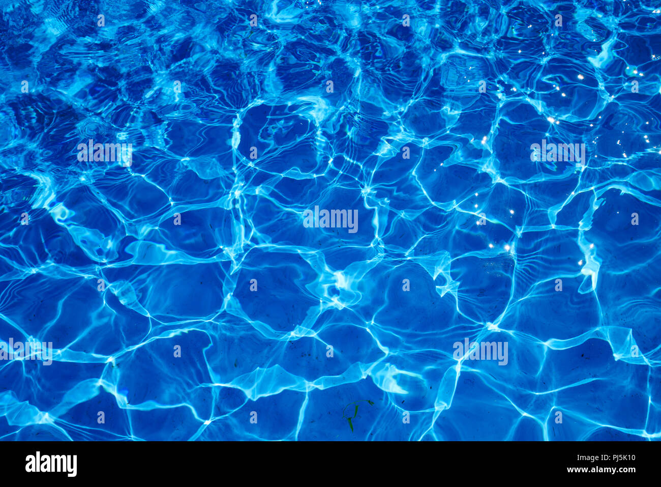 Blue ripped water in swimming pool Stock Photo - Alamy