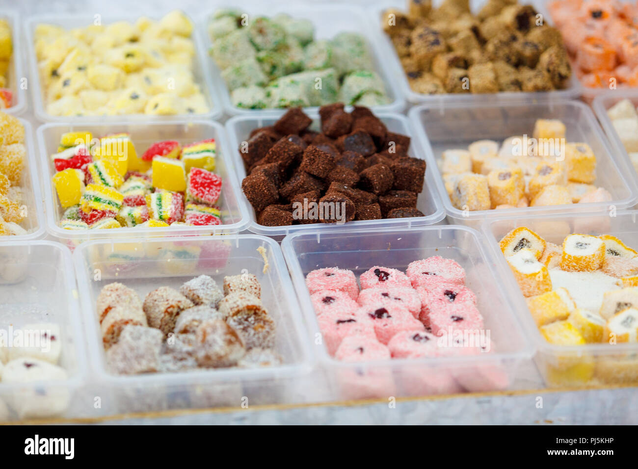 Sweet display on a market Stock Photo - Alamy