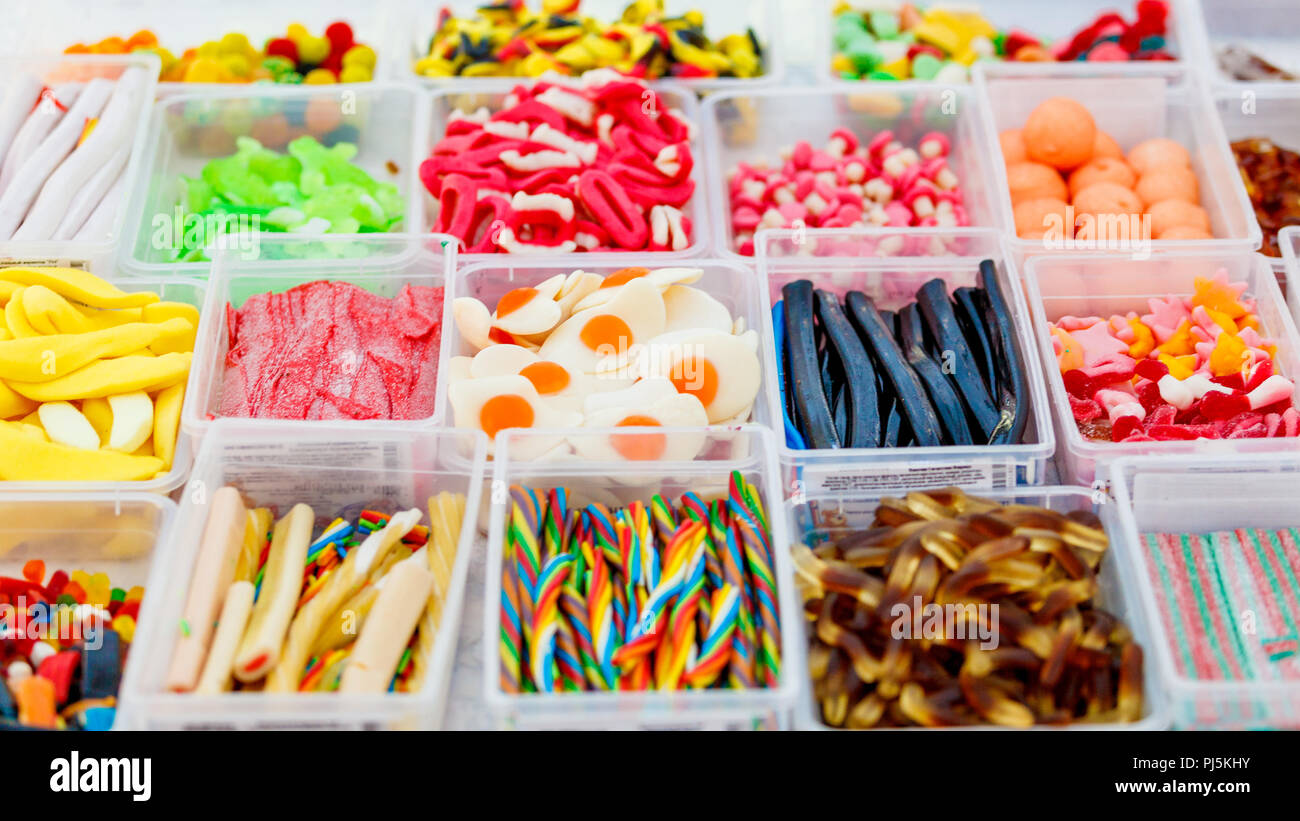 Sweet display on a market Stock Photo - Alamy