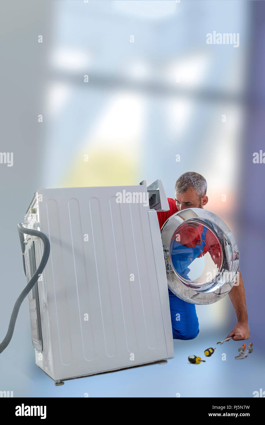 Washing machine repair hi-res stock photography and images - Alamy