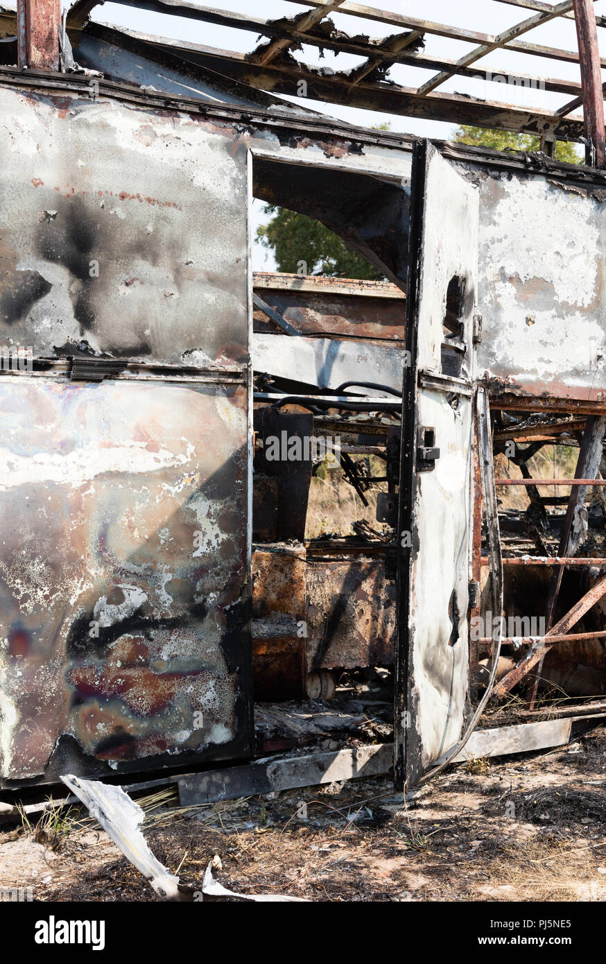 Burned bus at the side of the road, door, Botswana Stock Photo - Alamy