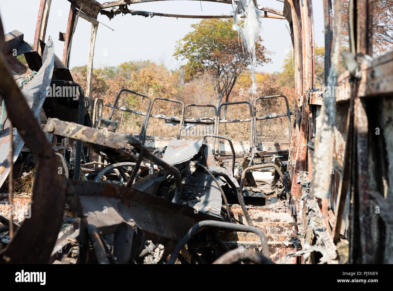 Burned bus at the side of the road - Seats in the back, Botswana Stock ...