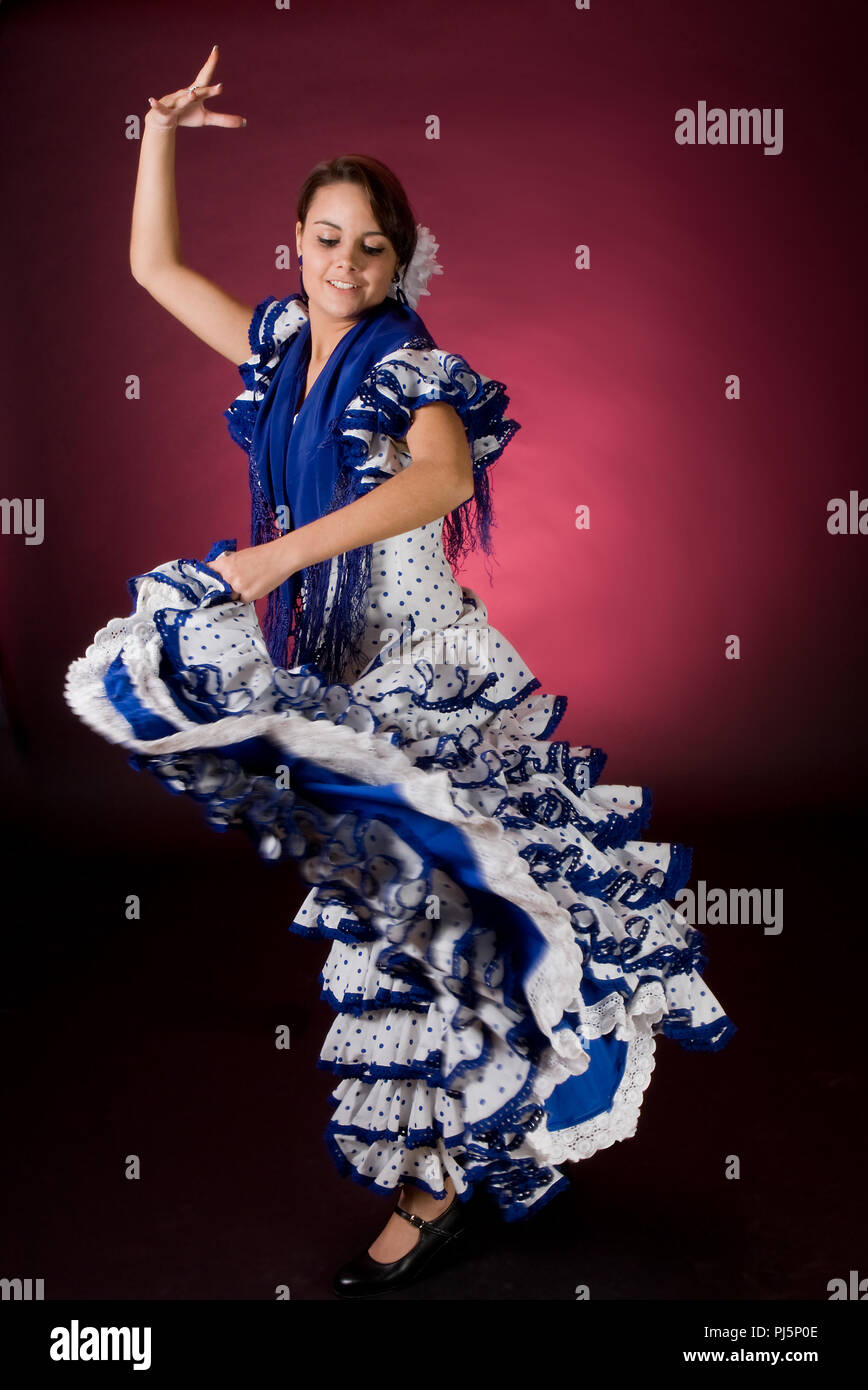 Young Spanish flamenco dancer in a blue dress, in full motion Stock ...