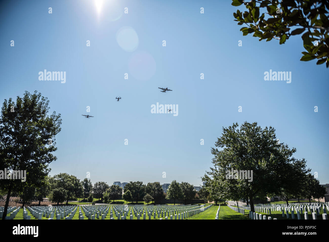 A flyover known as the Missing Man Formation passes over Section 67 and ...