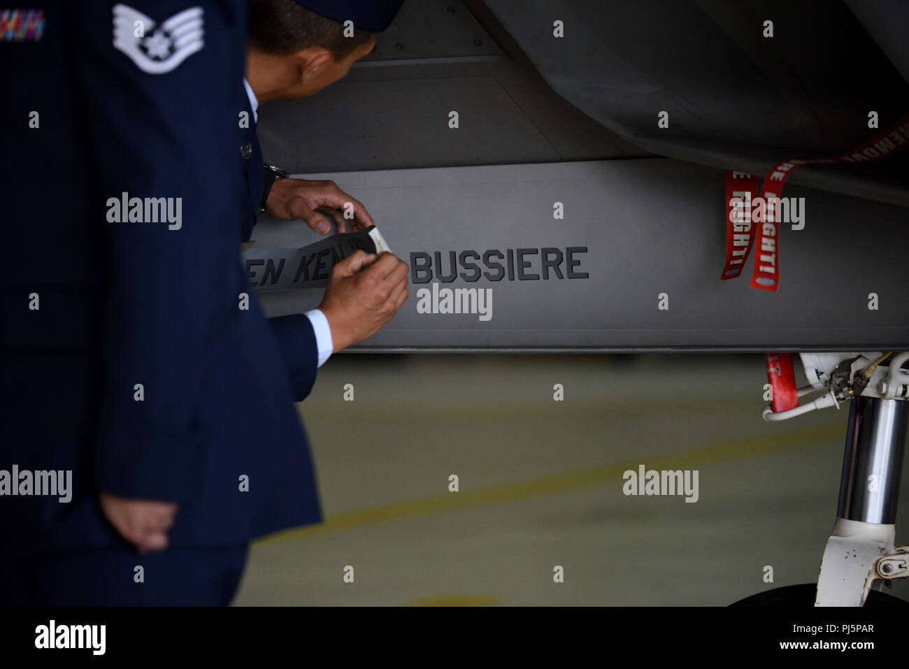 A U.S. Air Force airman reveals the name of Lt. Gen. Thomas A. Bussiere ...