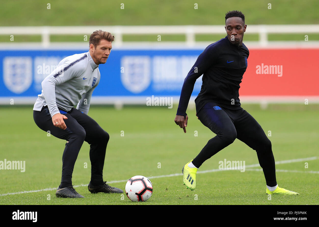 England striking coach Allan Russell and Danny Welbeck during a ...