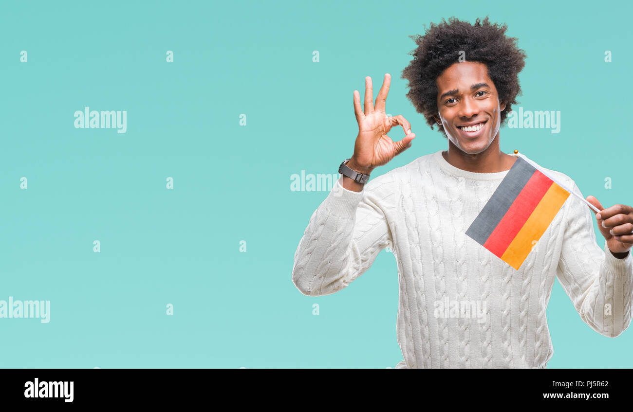 Afro american man flag of Germany over isolated background doing ok ...