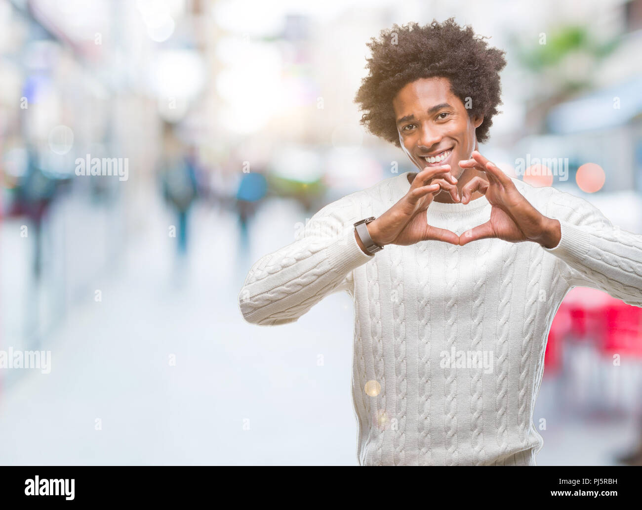 Afro american man over isolated background smiling in love showing ...