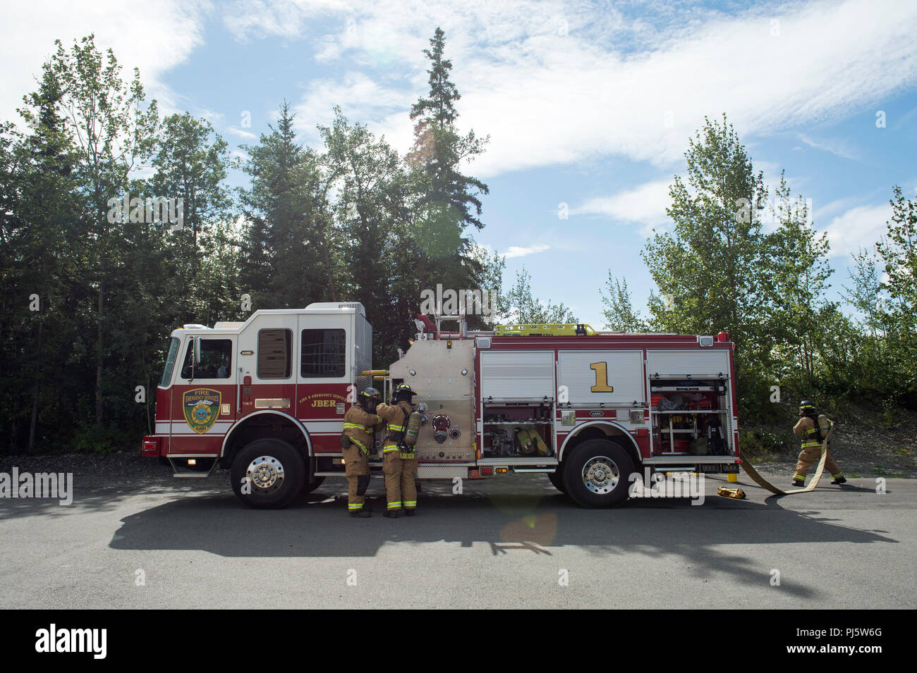 U.S. Air Force fire protection specialists assigned to the 673d Civil ...