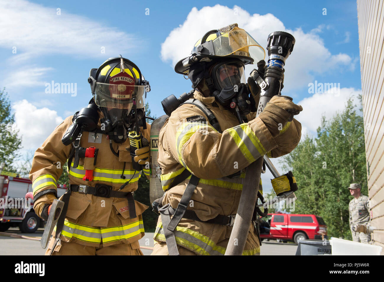 U.S. Air Force Staff Sgt. Corey Loesch, left, and Airman 1st Class ...