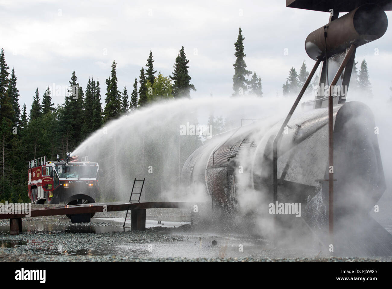 U.S. Air Force fire protection specialists assigned to the 673d Civil ...