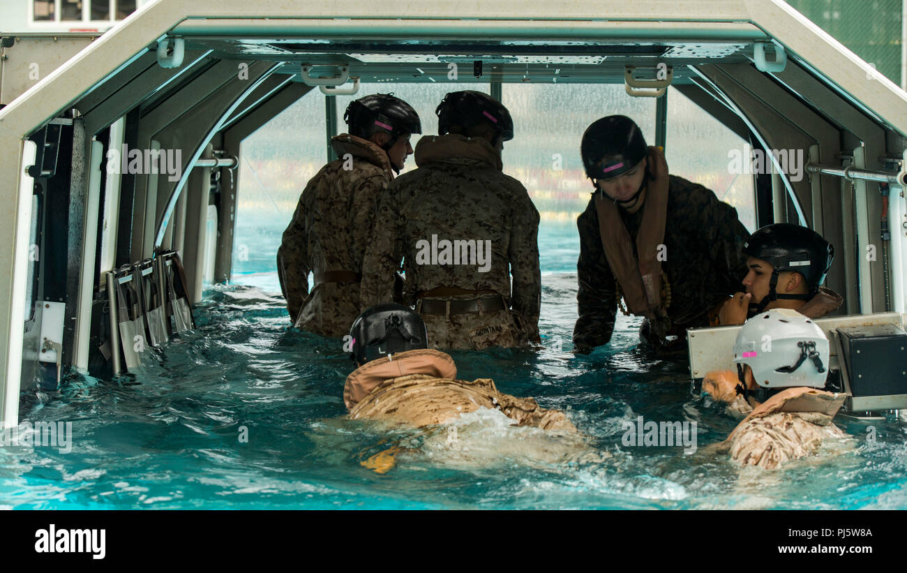 U.S. Marines assigned to 3d Battalion, 3d Marine Regiment, enter a ...