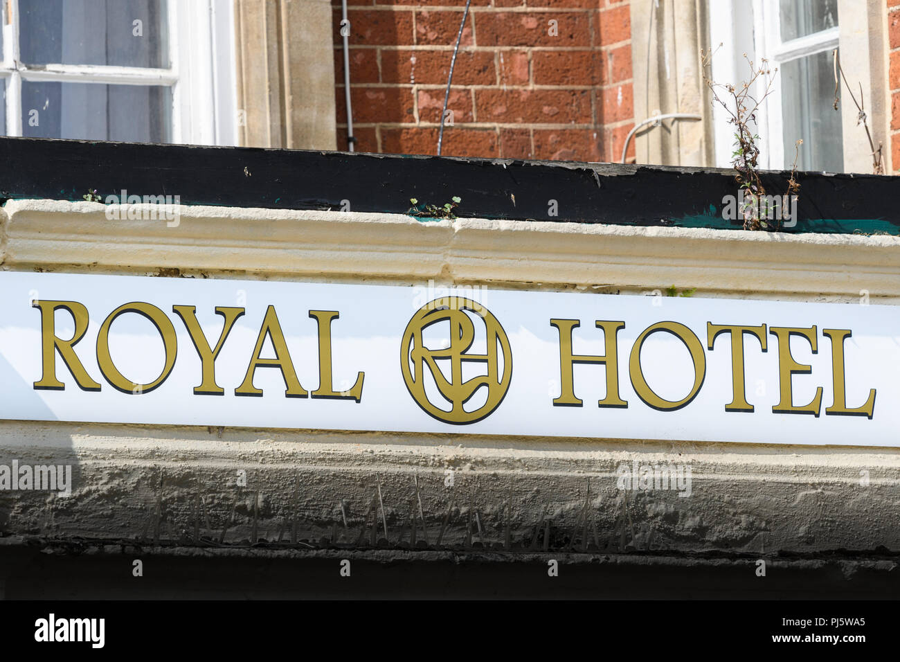 Sign outside the Royal hotel in the High Street at the town centre of ...
