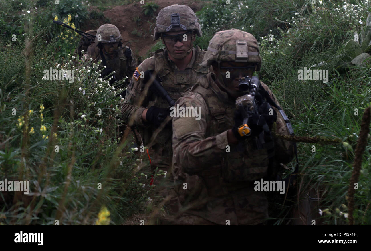 Infantrymen with the 1st Squadron, 2nd Cavalry Regiment clear a trench ...