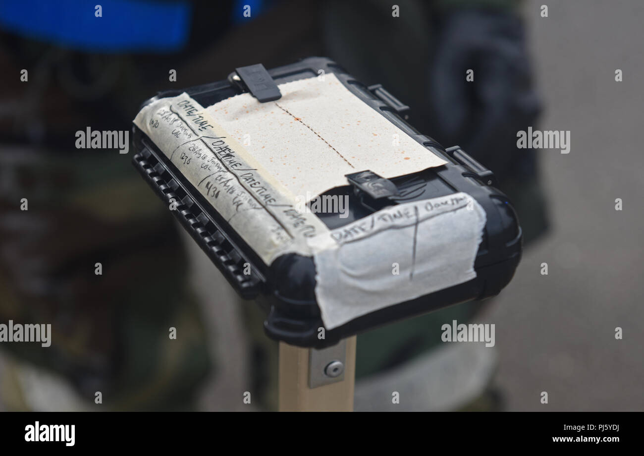 M8 chemical agent detector paper is examined by a post attack ...