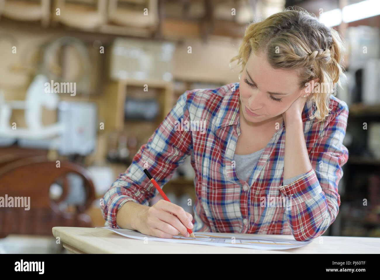 Female carpenter taking notes hi-res stock photography and images - Alamy