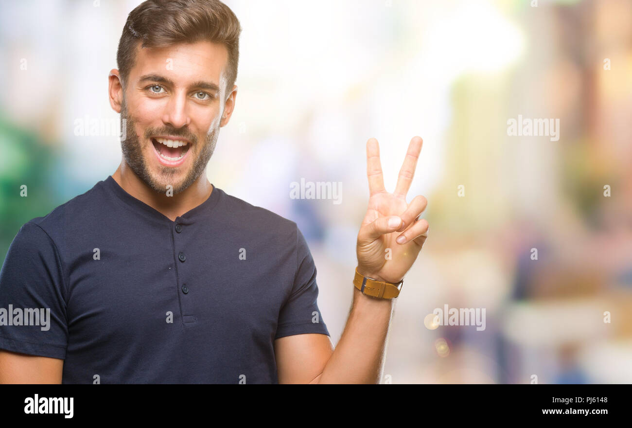 Young handsome man over isolated background smiling with happy face ...