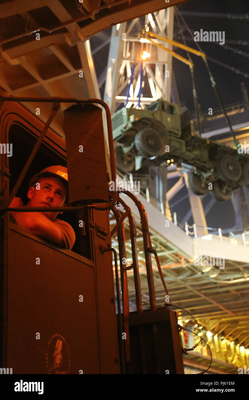U.S. Navy Equipment Operator 2nd Class Sawyer Buck, assigned to Naval ...