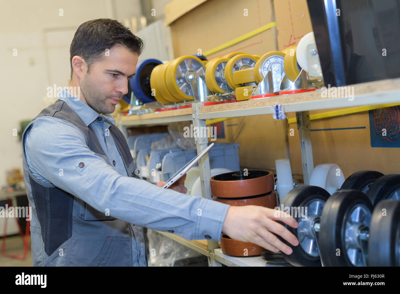wheels of shopping carts in a factory Stock Photo - Alamy