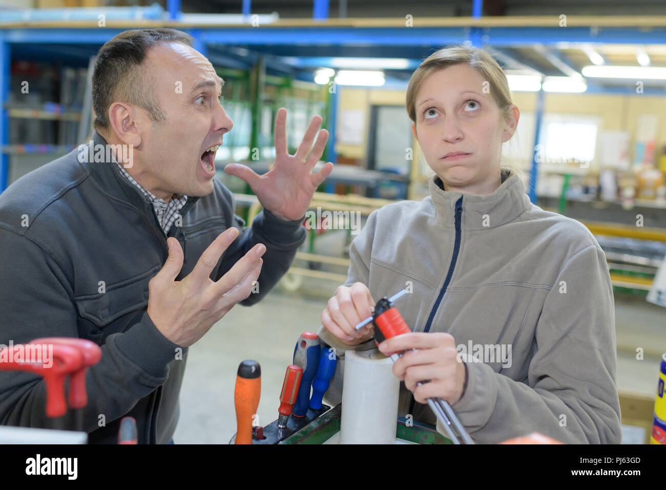 manager shouting at the worker Stock Photo - Alamy