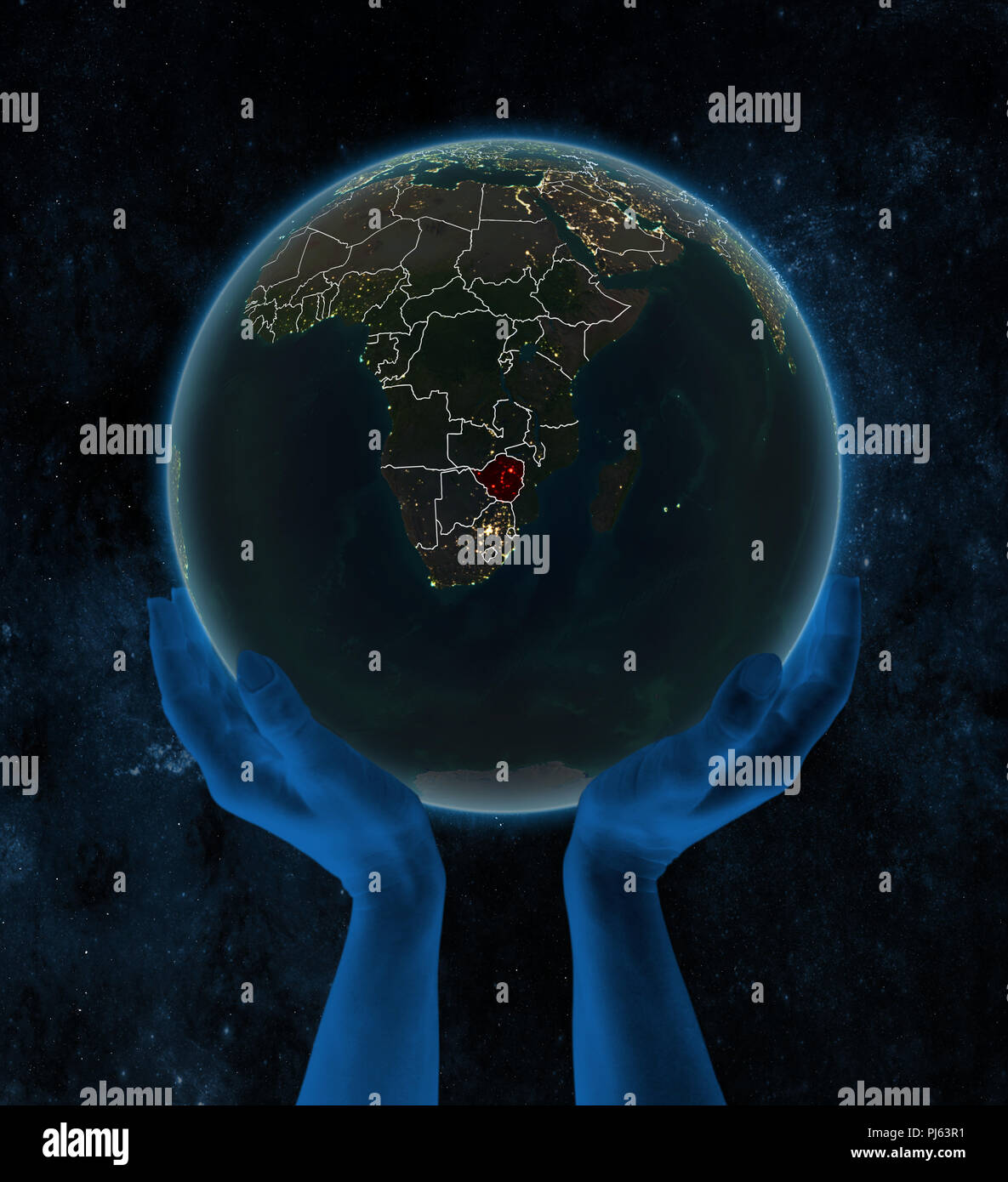 Zimbabwe on night planet Earth with visible country borders in hands in ...