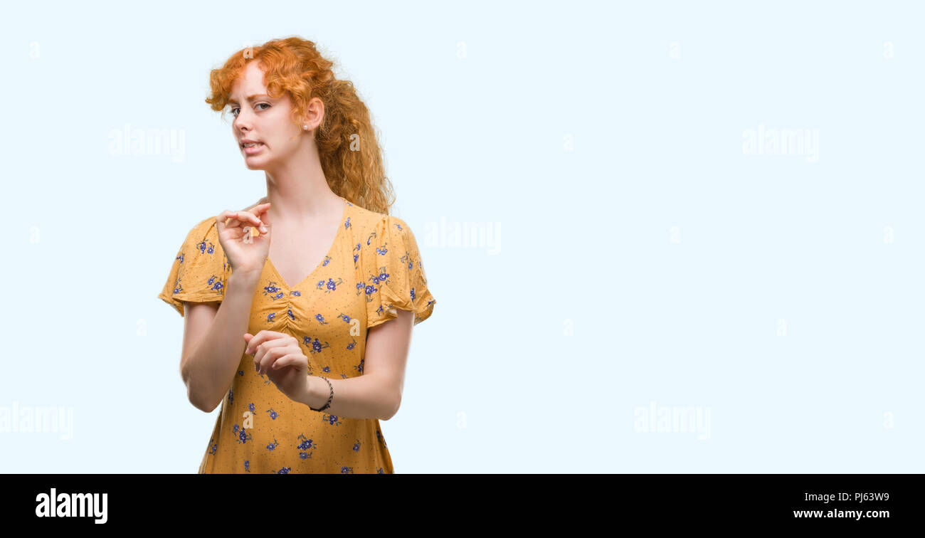 Young redhead woman disgusted expression, displeased and fearful doing ...