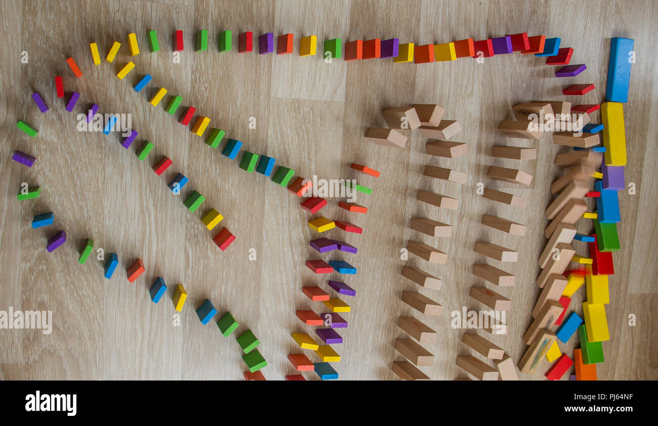 Colorful Domino Blocks in a line on a white background Stock Photo - Alamy