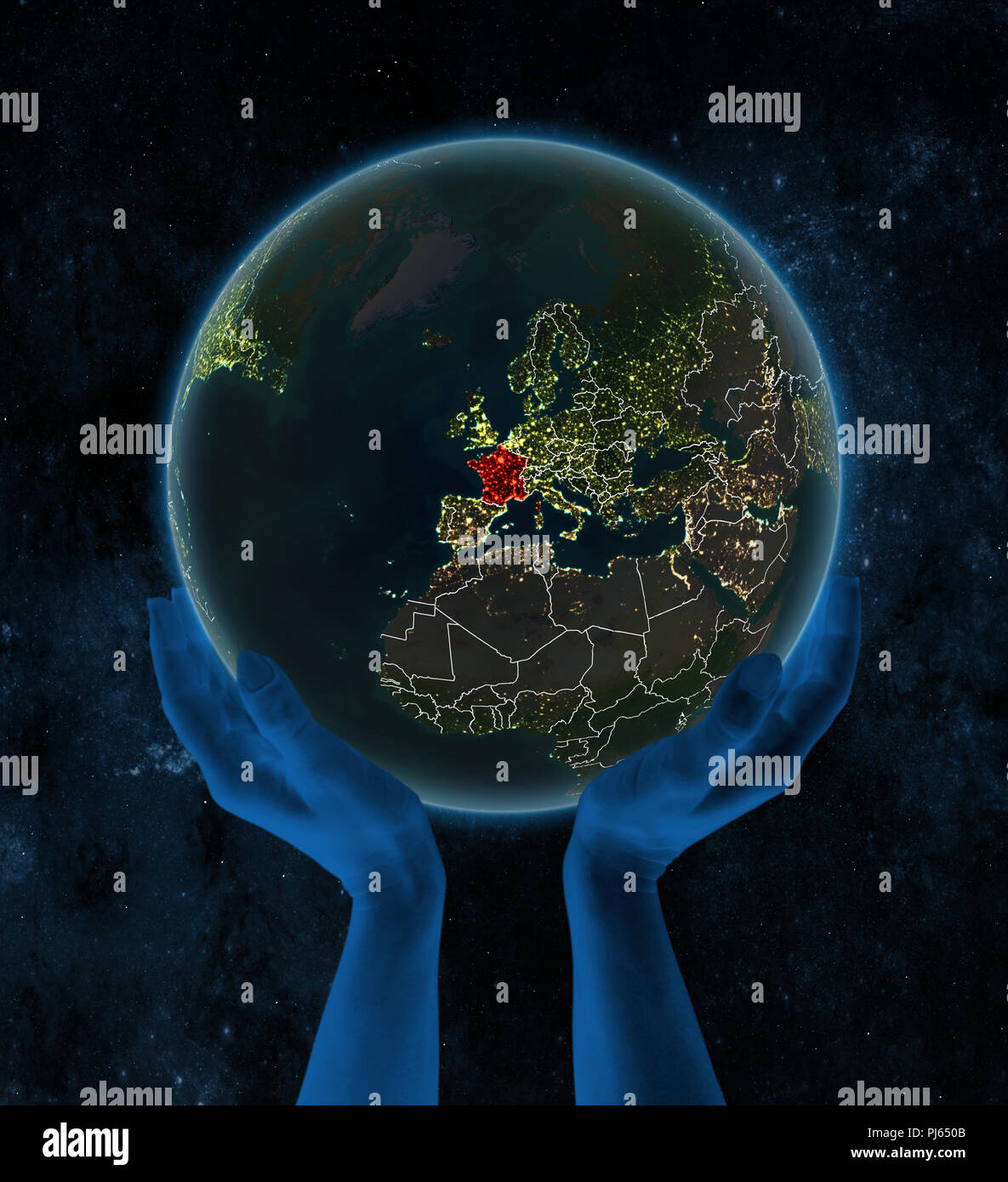 France on night planet Earth with visible country borders in hands in ...