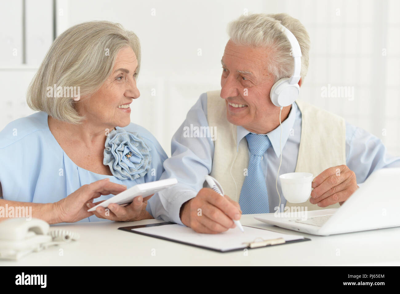 Portrait of senior businesspeople working in the office together Stock ...