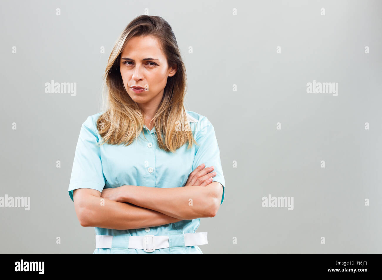 Angry nurse thinking about something Stock Photo - Alamy