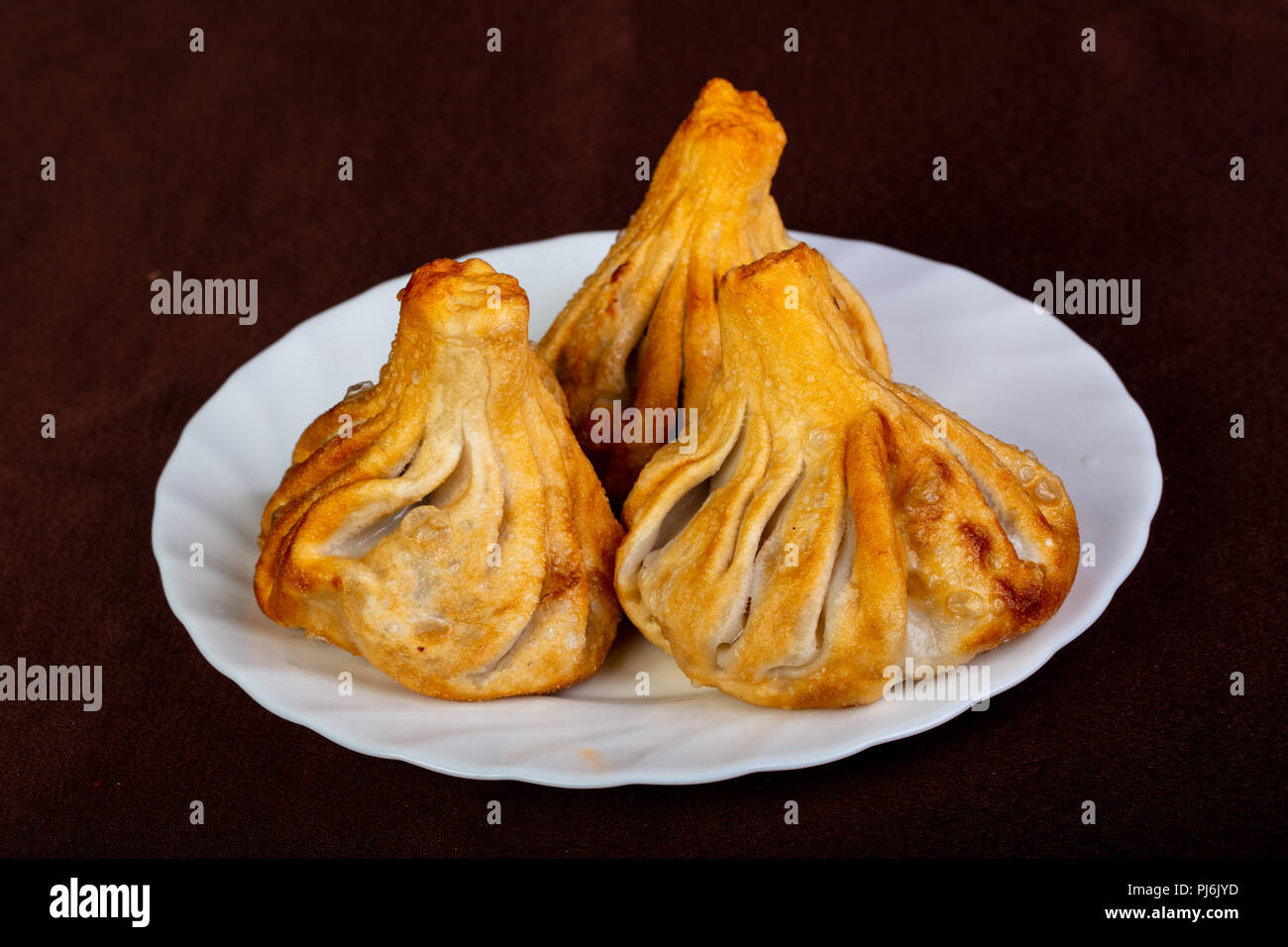 Fried Georgian Khinkali with meat Stock Photo - Alamy