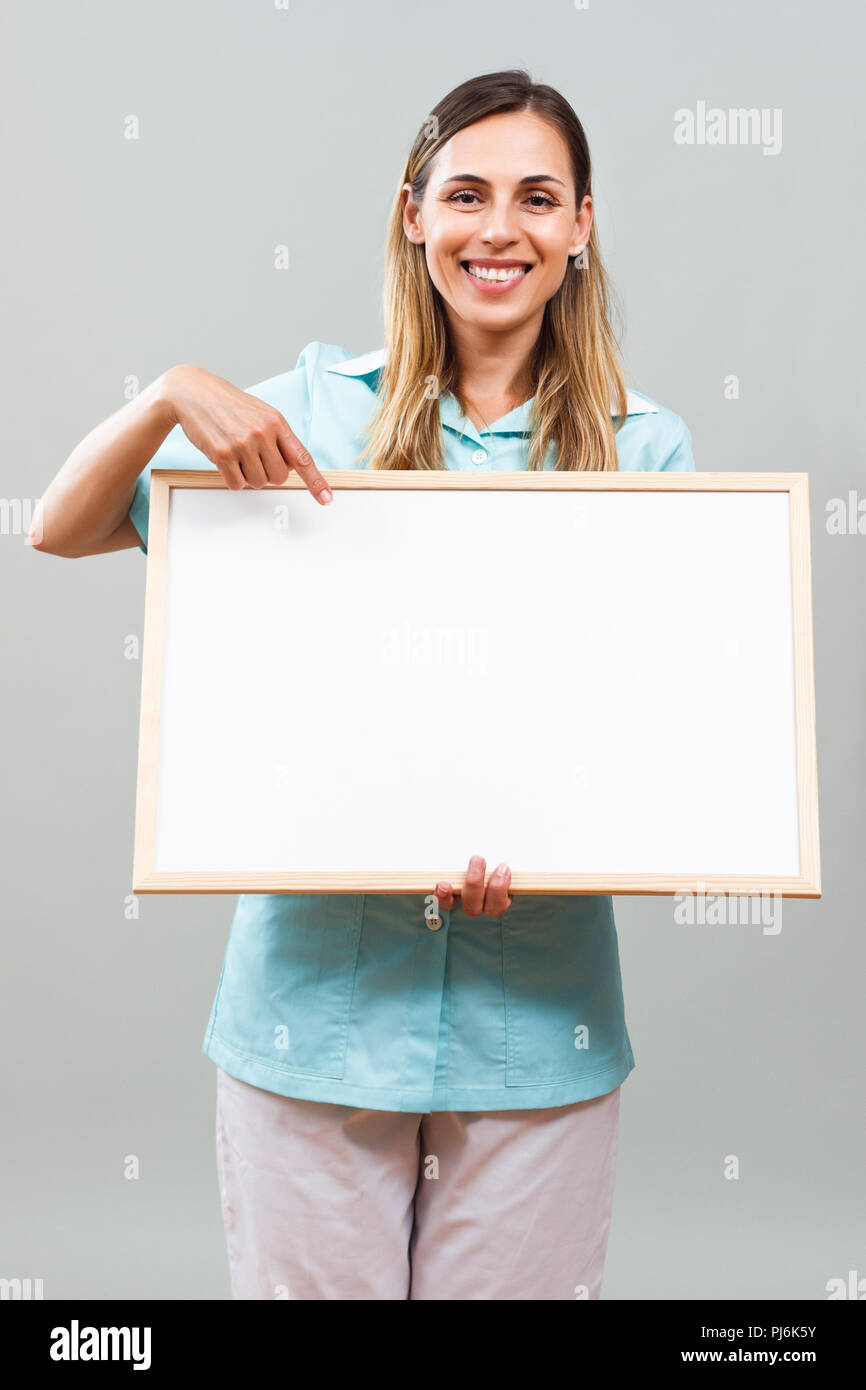 Beautiful nurse is pointing at whiteboard Stock Photo - Alamy