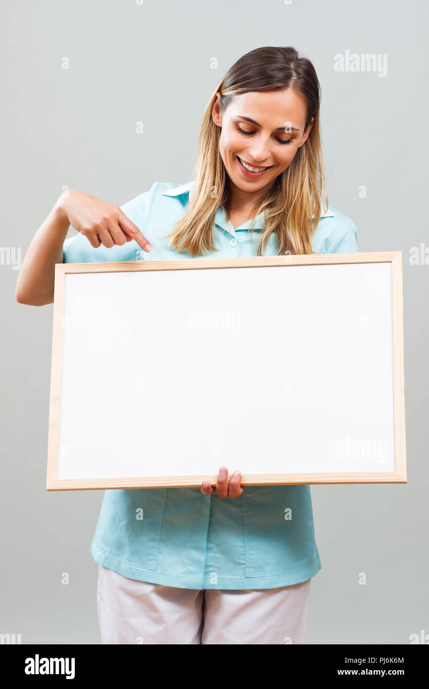 Beautiful nurse is pointing at whiteboard Stock Photo - Alamy