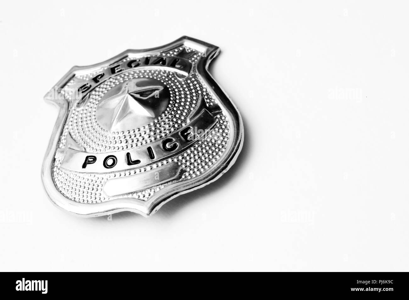 police metal badge isolated Stock Photo - Alamy