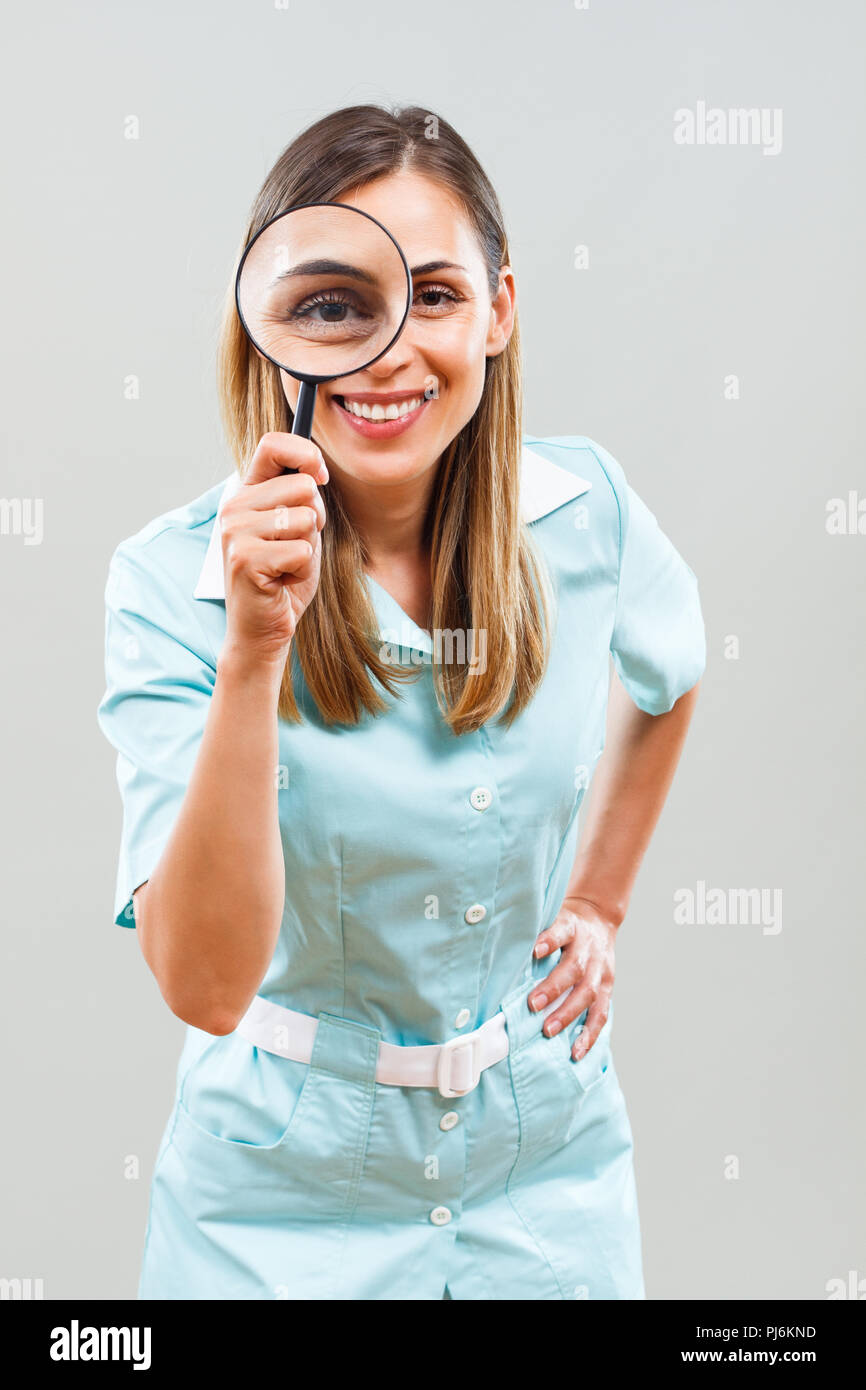 Nurse magnifying glass hi-res stock photography and images - Alamy