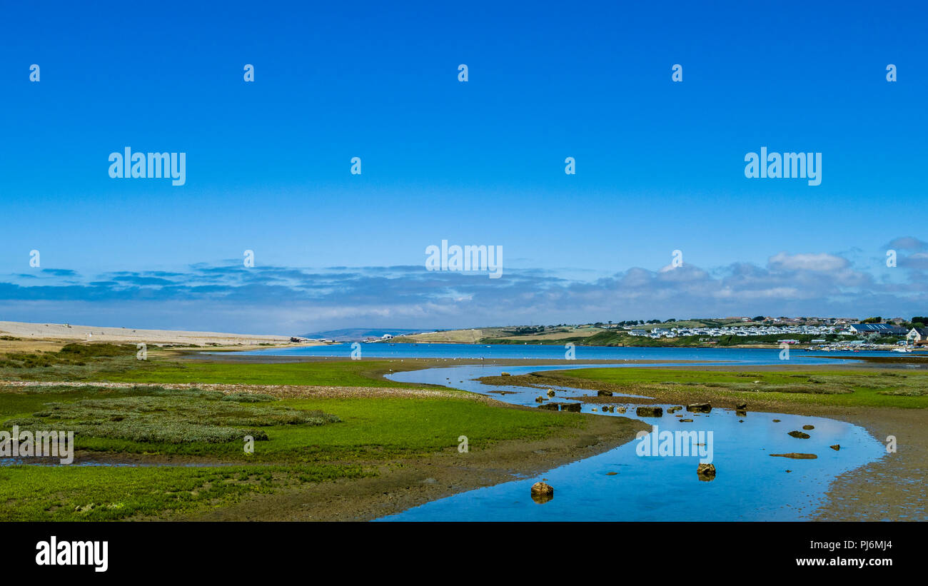 Stream of water leading to Fleet Lagoon at Chesil beach, Dorset ...