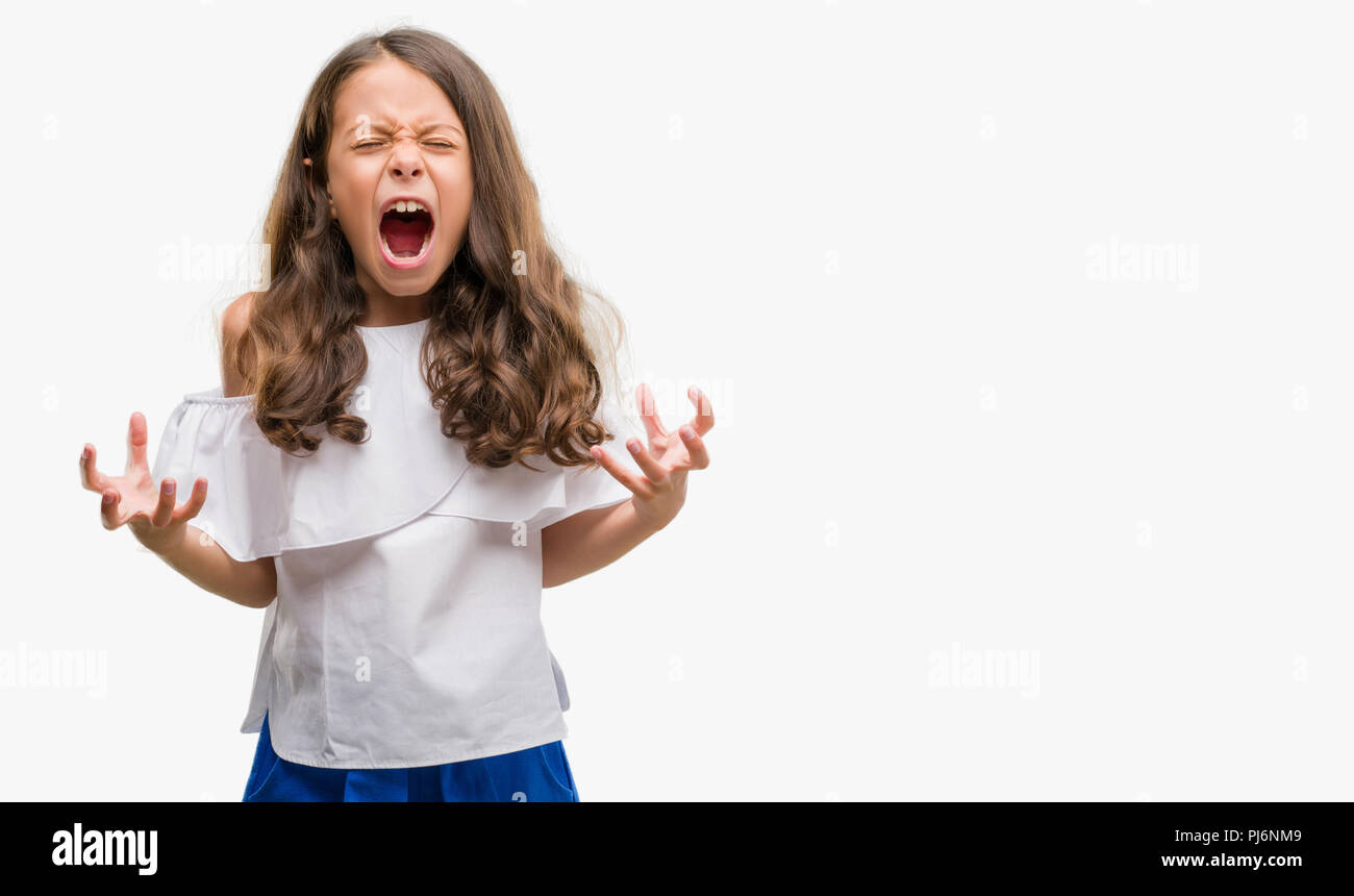 Brunette hispanic girl crazy and mad shouting and yelling with ...